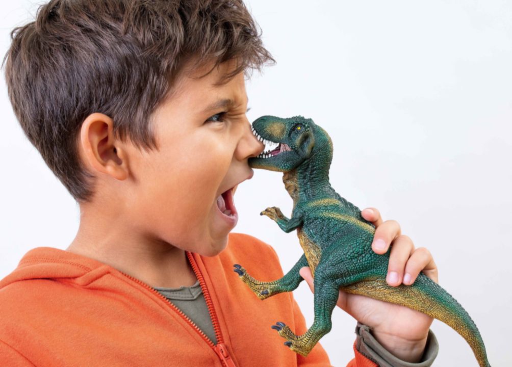 Children enjoy exploring the world of realistic dinosaur models